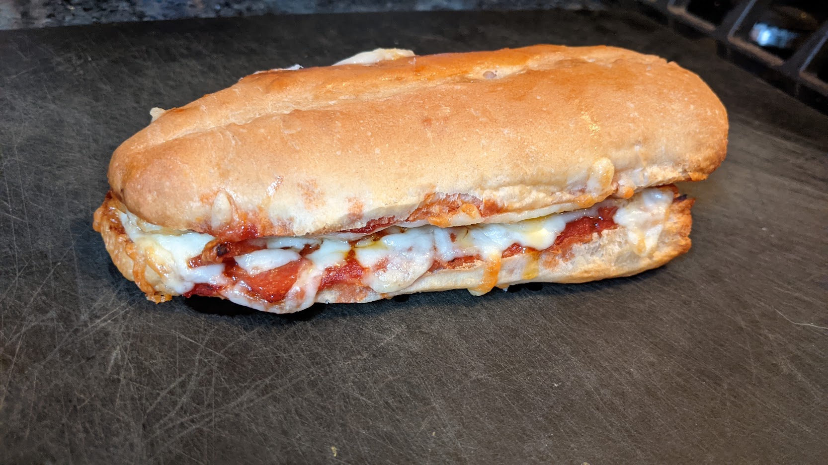 Open-faced pizza sandwich – Bounded by Buns